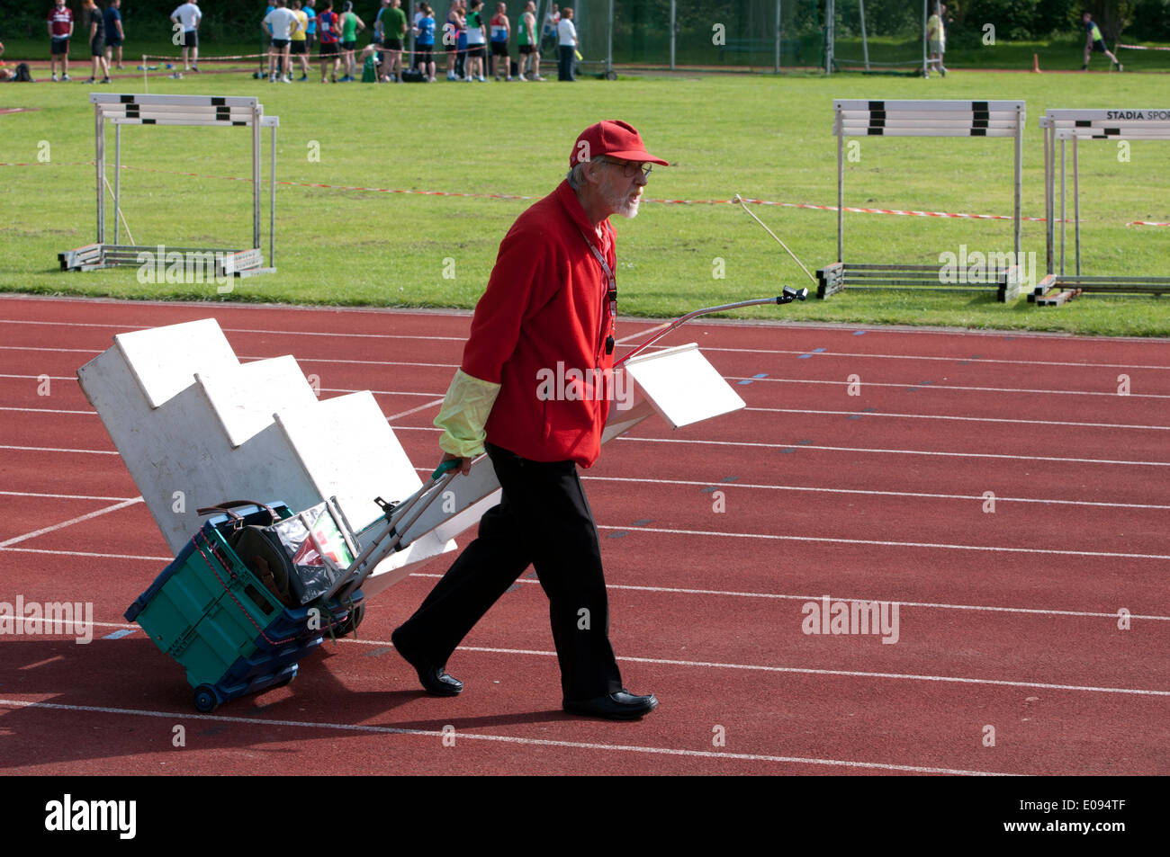 Athletics, the starter towing his rostrum and equipment Stock Photo - Alamy