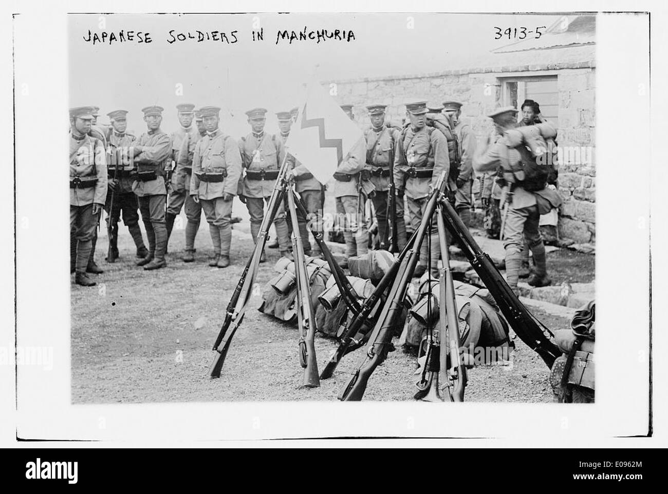 This historical photograph depicts Japanese soldiers in Manchuria ...