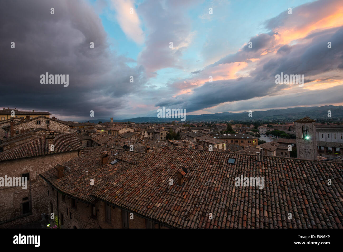 Roofs of an old town at sunset with colored clouds in the sky Stock ...