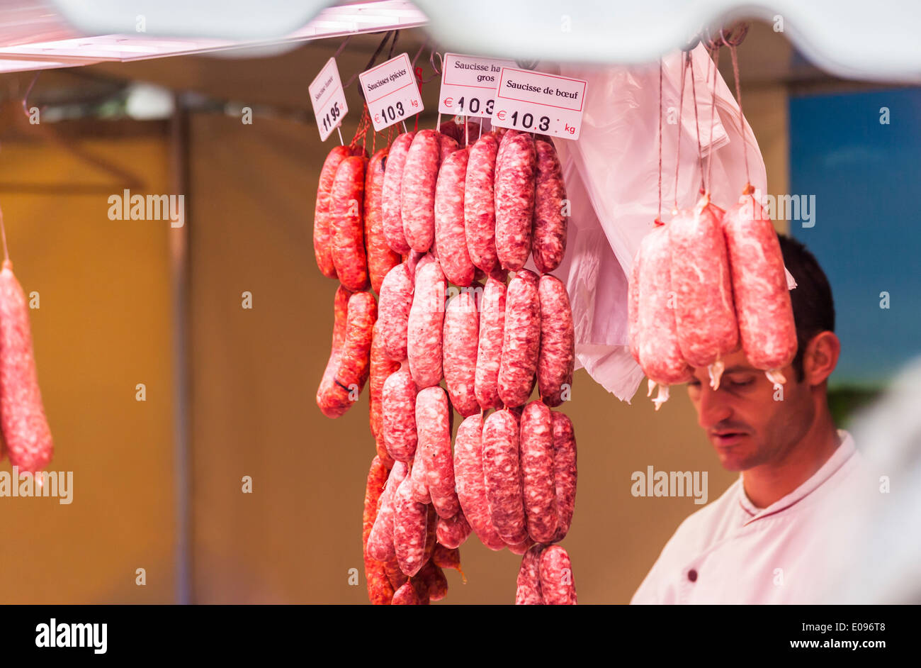 Strings of sausages hung up on display for sale at a stall in Annecy ...
