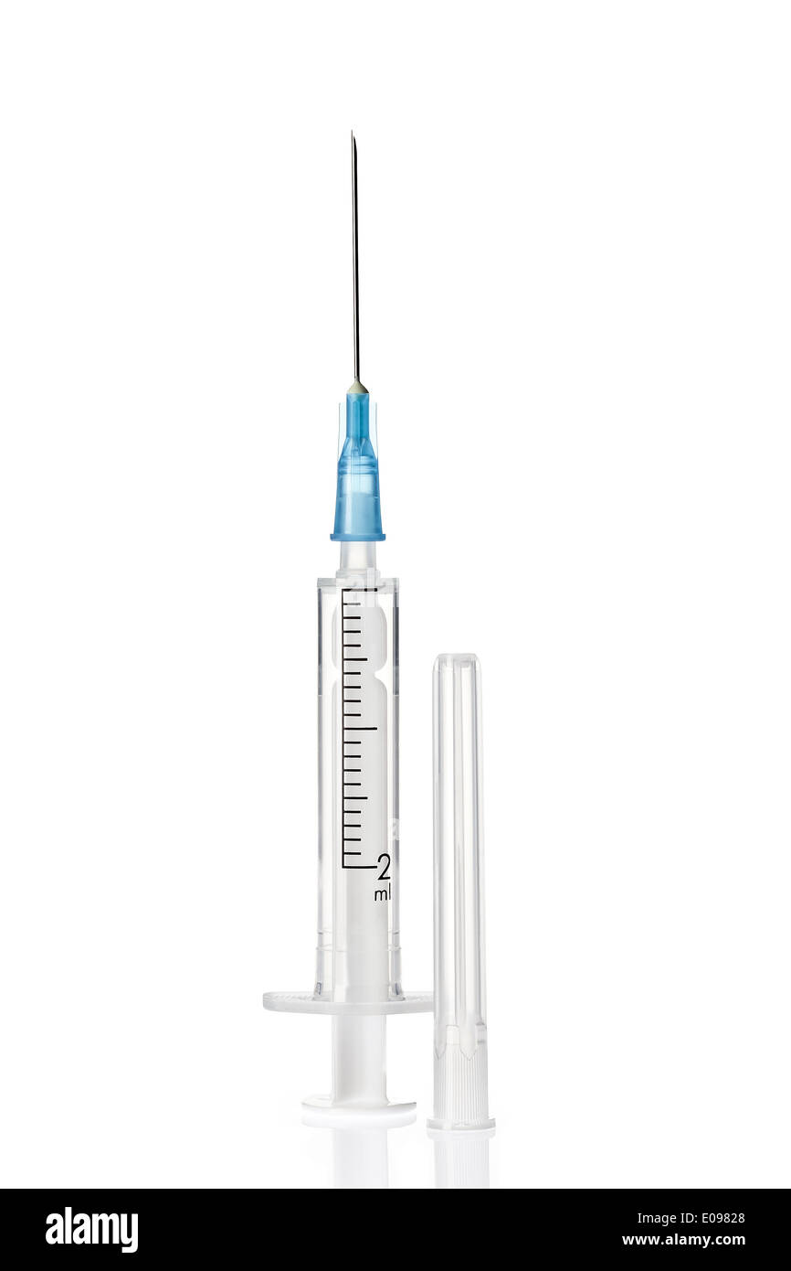 Close up view of white plastic syringe on white back Stock Photo - Alamy