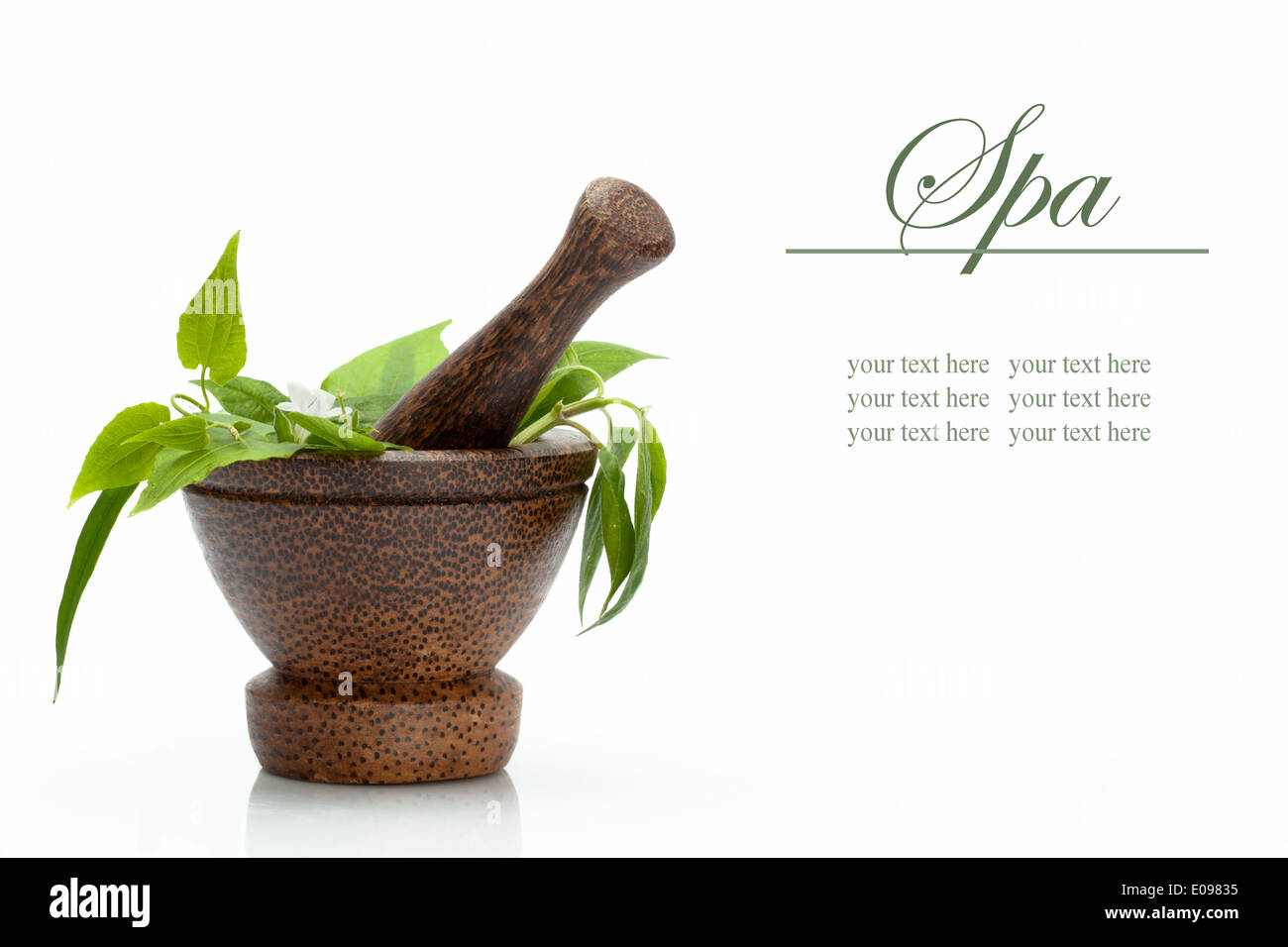 Close up view of brown mortar with ingredients inside on white back ...