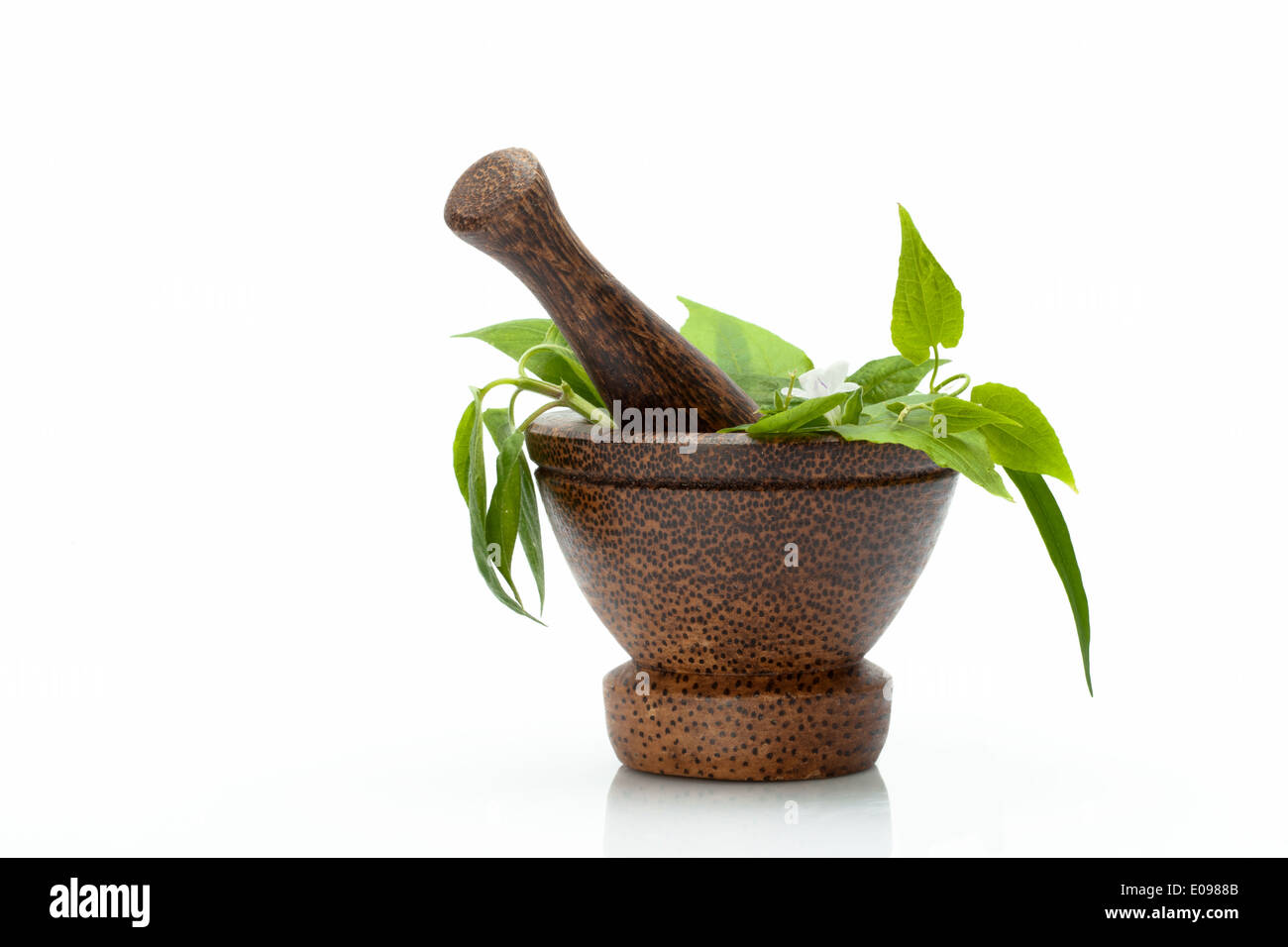 Close up view of brown mortar with ingredients inside on white Stock ...