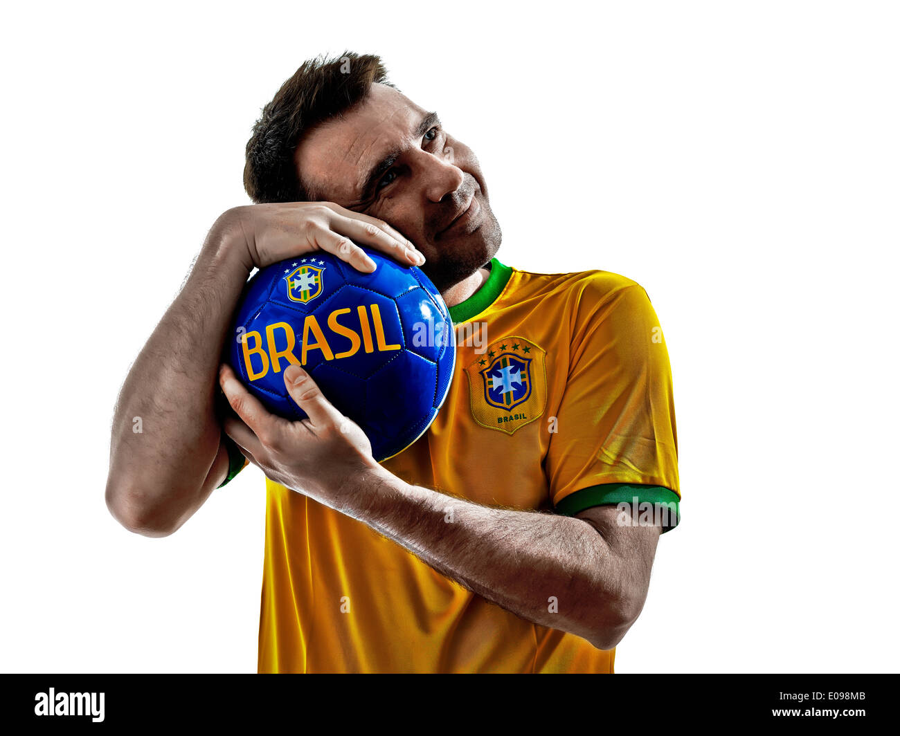 one man with Brazilian jersey hugging soccer ball isolated in white ...