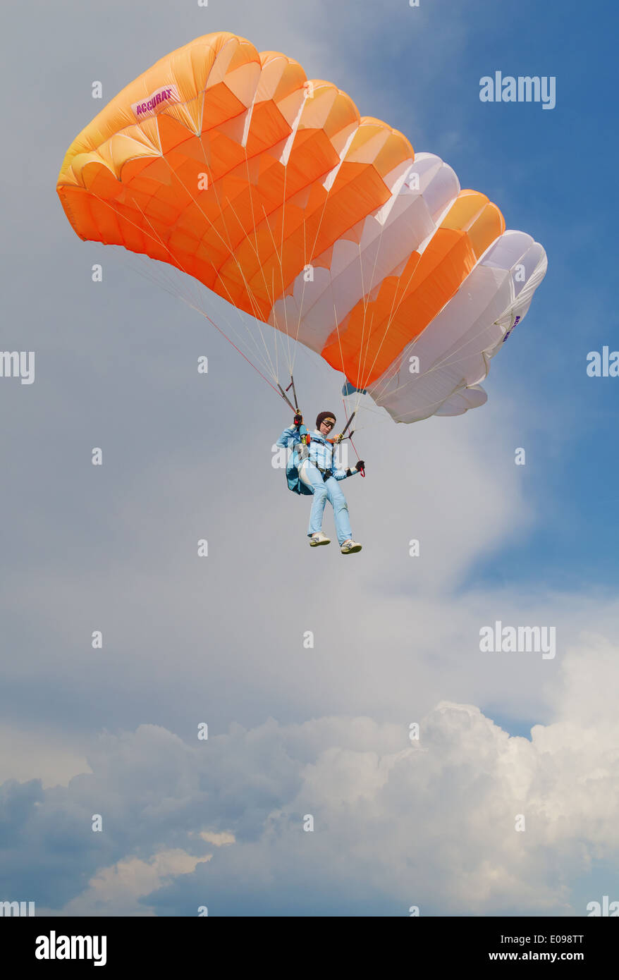 One day with parachutist in airfield. The girl skydiver lands under the ...