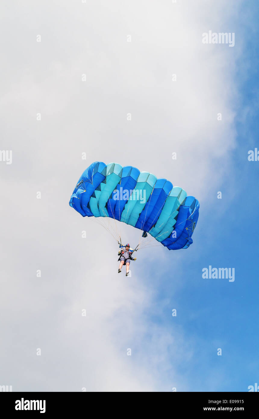 One day with parachutist in airfield. The girl skydiver lands under the ...
