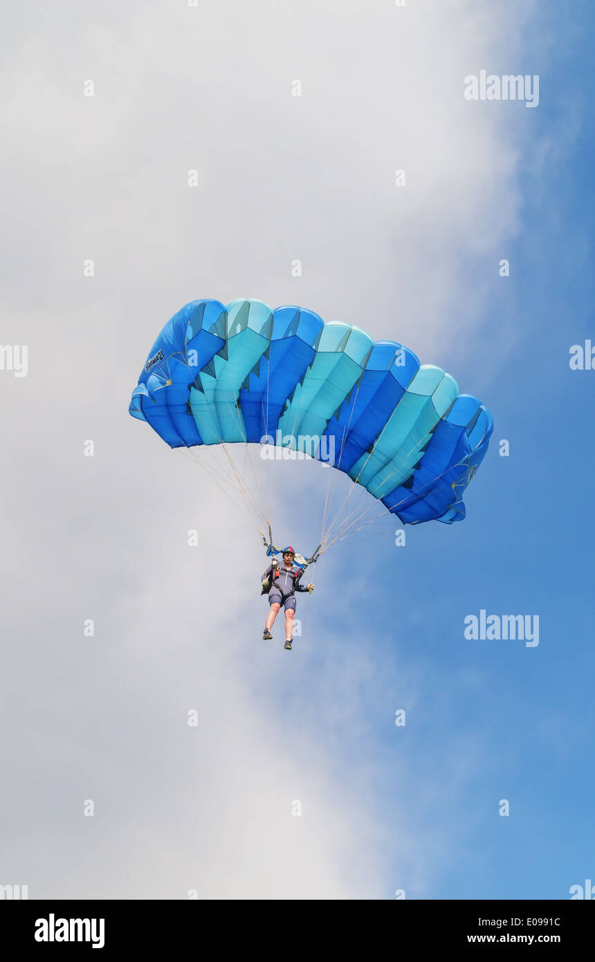 One day with parachutist in airfield. The girl skydiver lands under the ...