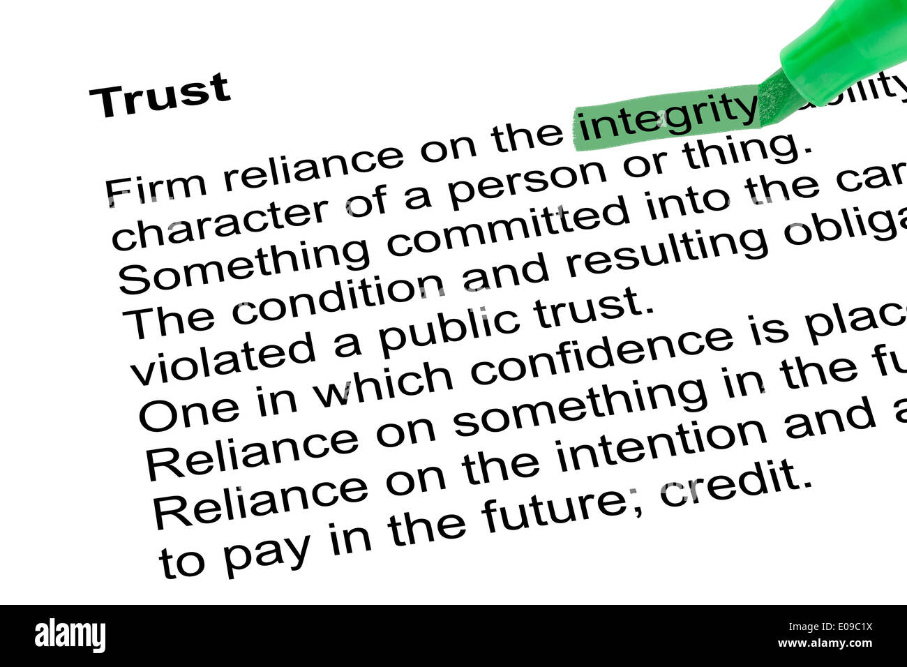 Highlighted word integrity for Trust with green pen over white paper ...