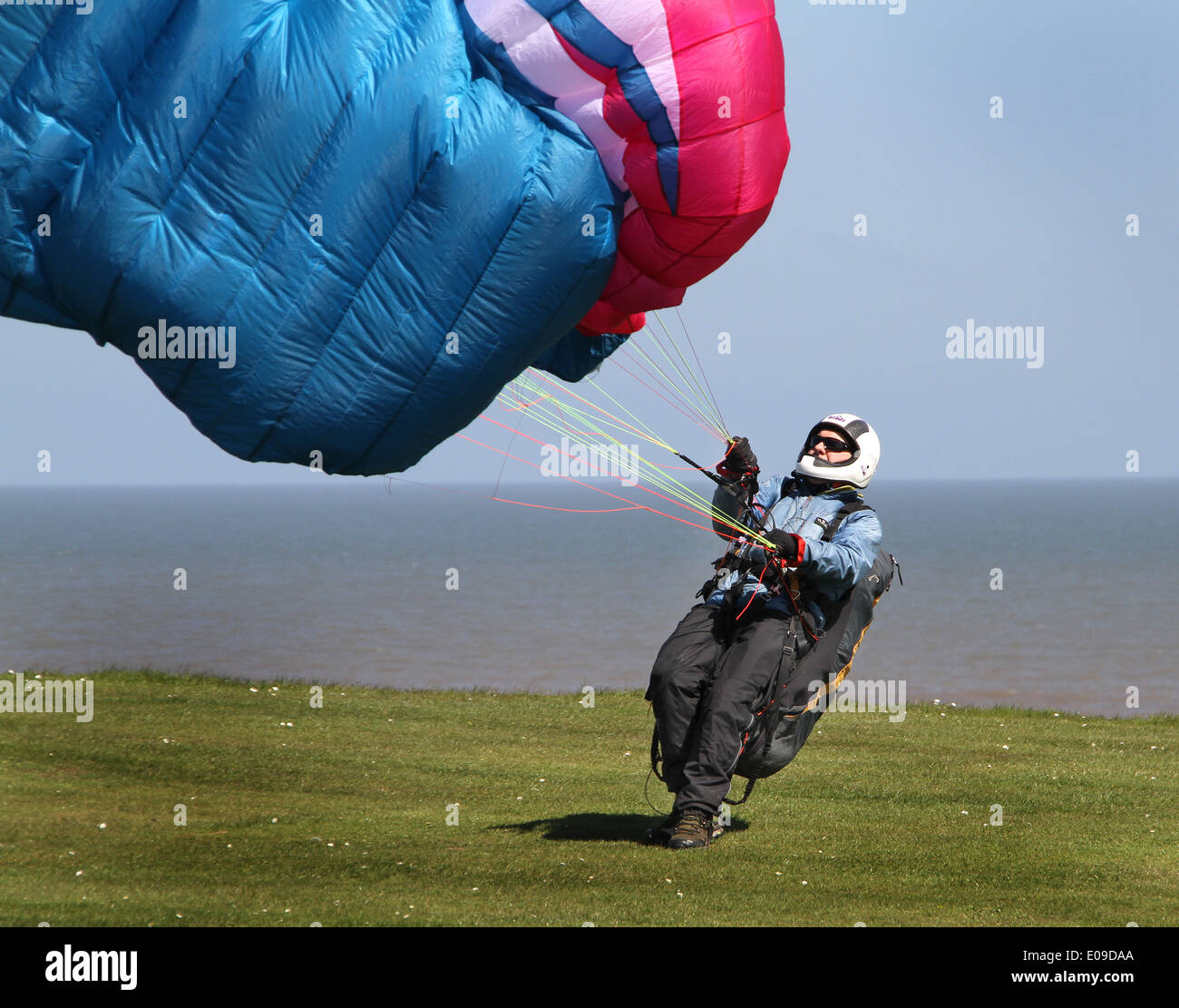 Paragliding with parachutes over clay cliffs, east Yorkshire Stock ...