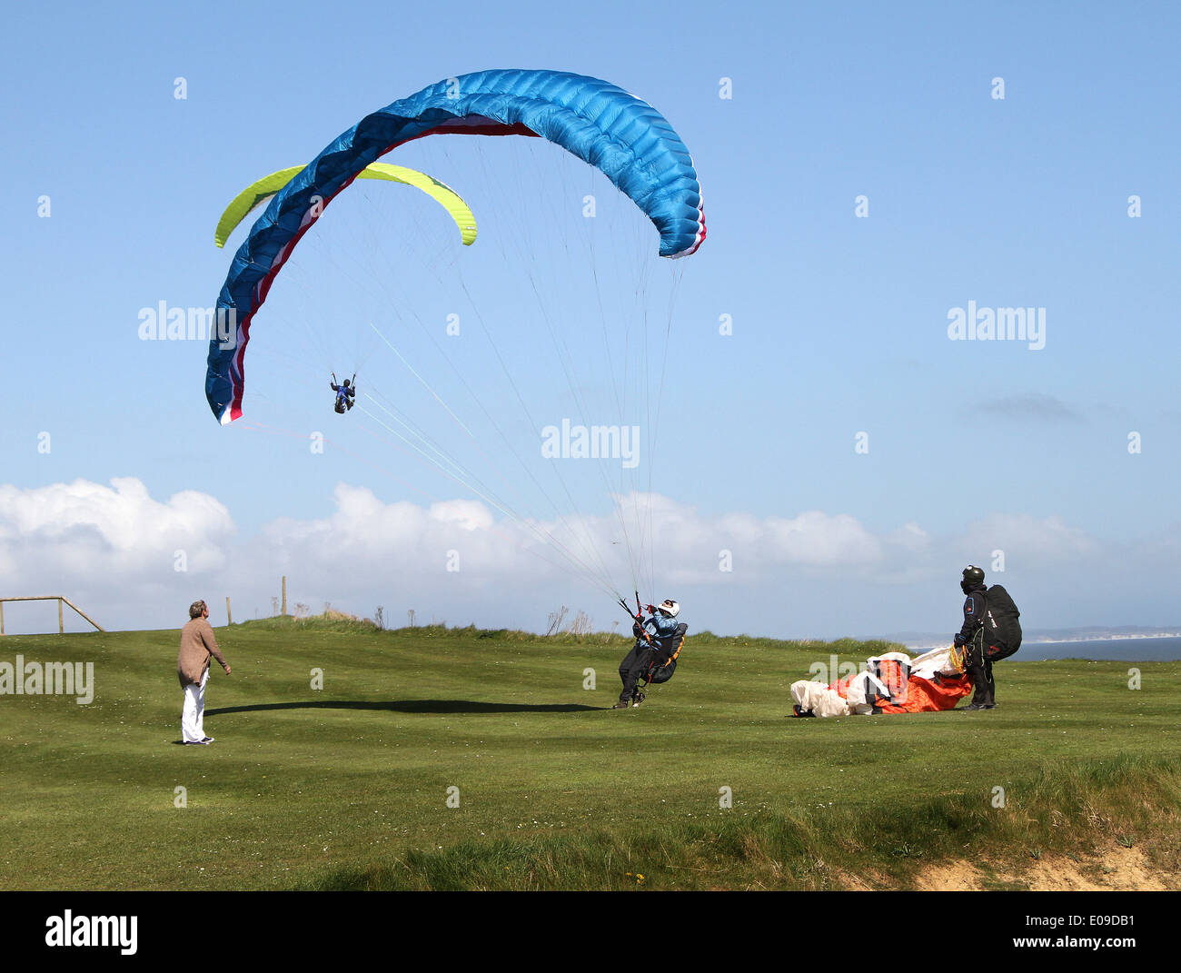 Paragliding with parachutes over clay cliffs, east Yorkshire Stock ...
