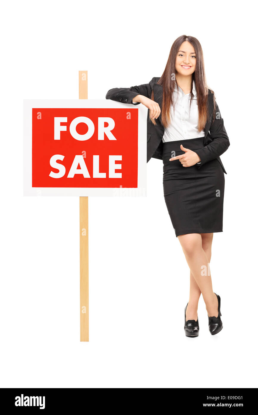 Woman pointing finger smiling Cut Out Stock Images & Pictures - Alamy