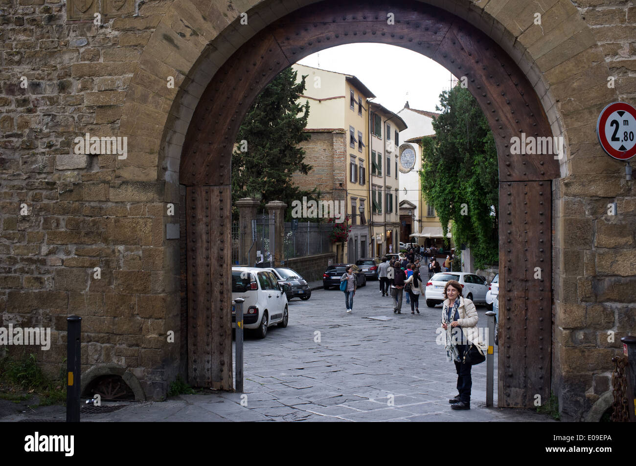 A gate in the ancient fortifications on Via di Belvedere allows ...
