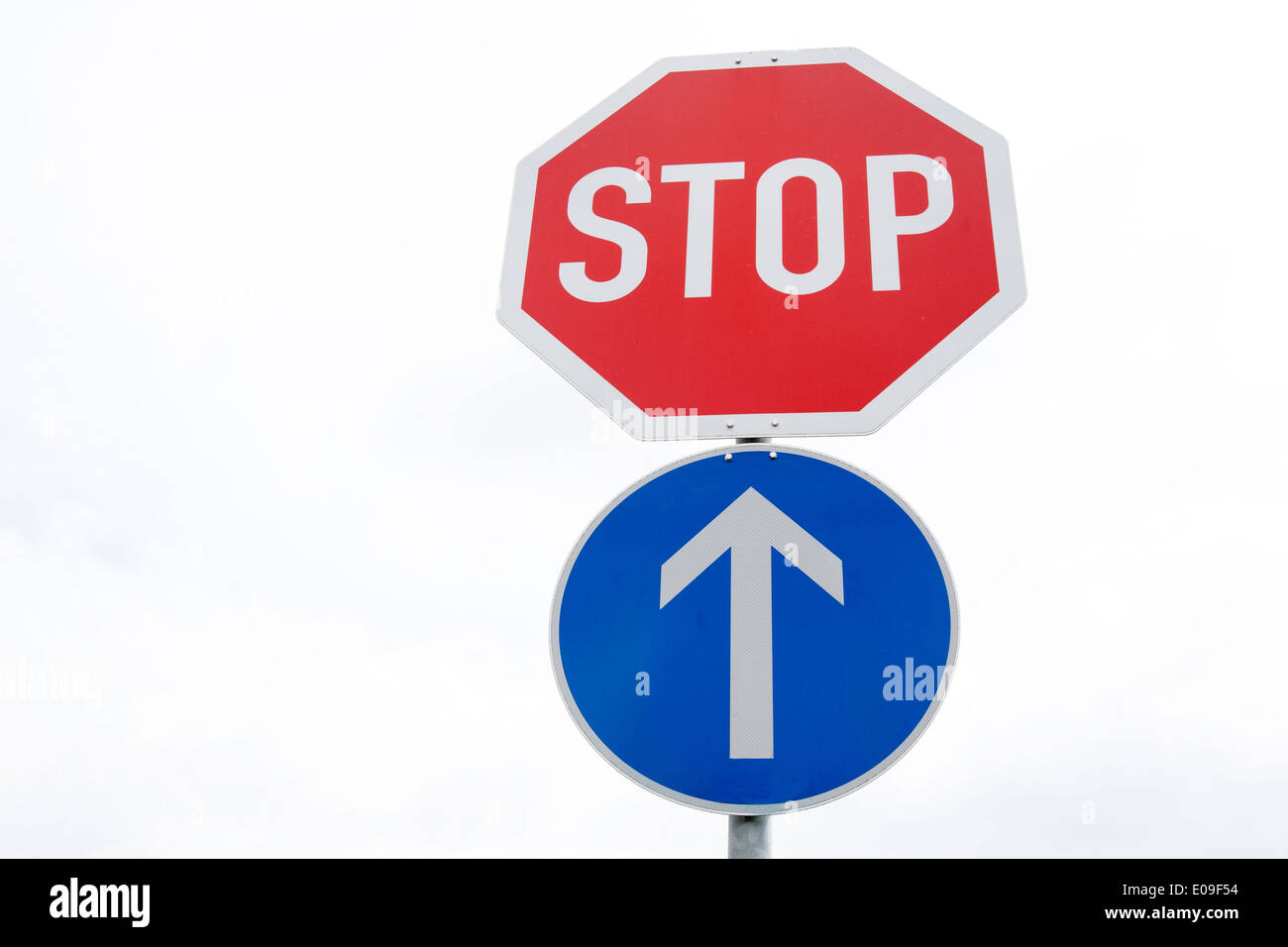 Red Stop and Blue One Way Traffic Sign on White Background Stock Photo ...