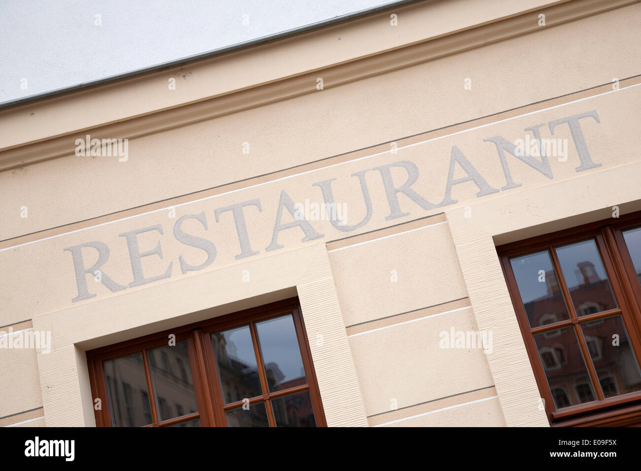 Silver Restaurant Sign on Wall Background on Diagonal Slant Stock Photo ...