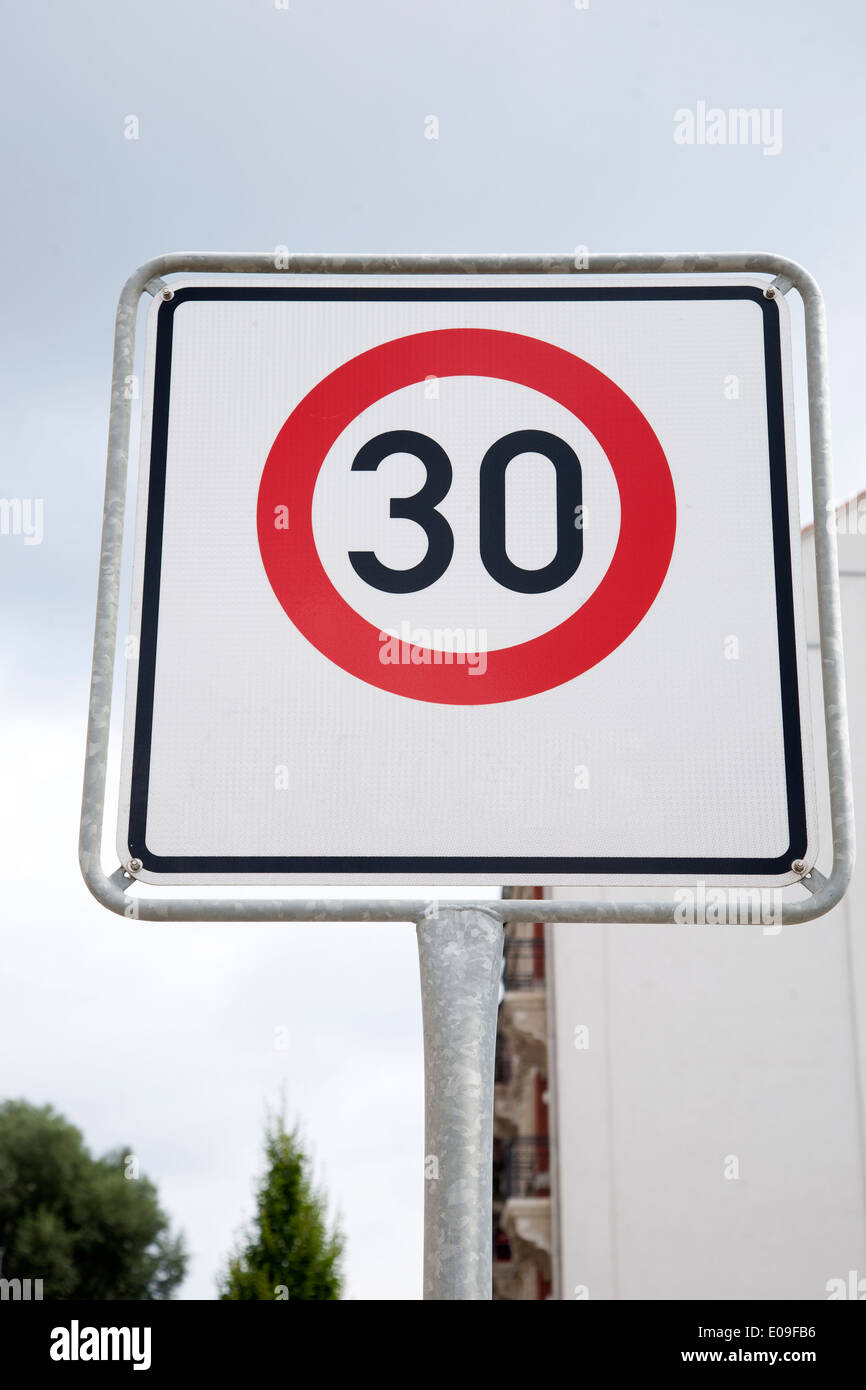 Red Thirty Speed Sign in Urban Setting Stock Photo - Alamy