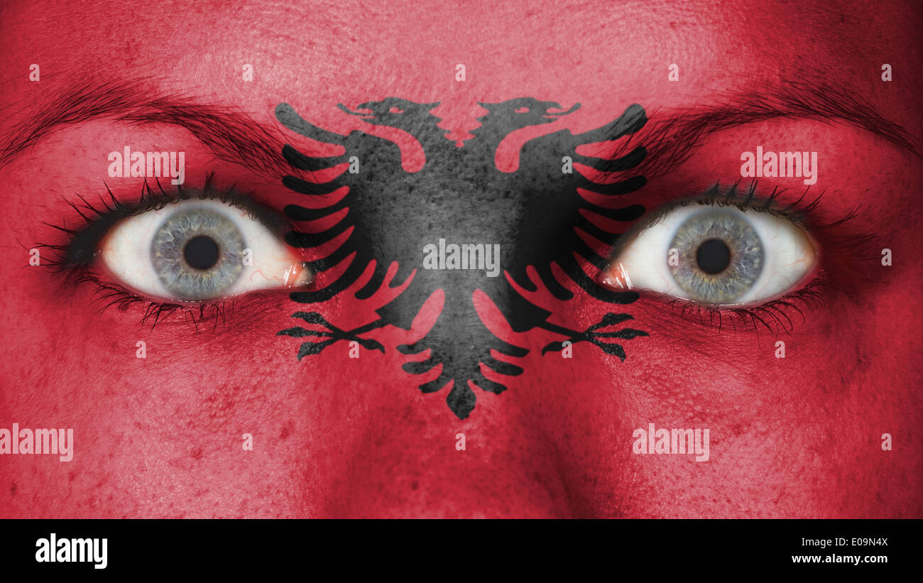 Close up of eyes. Painted face with flag of Albania Stock Photo - Alamy