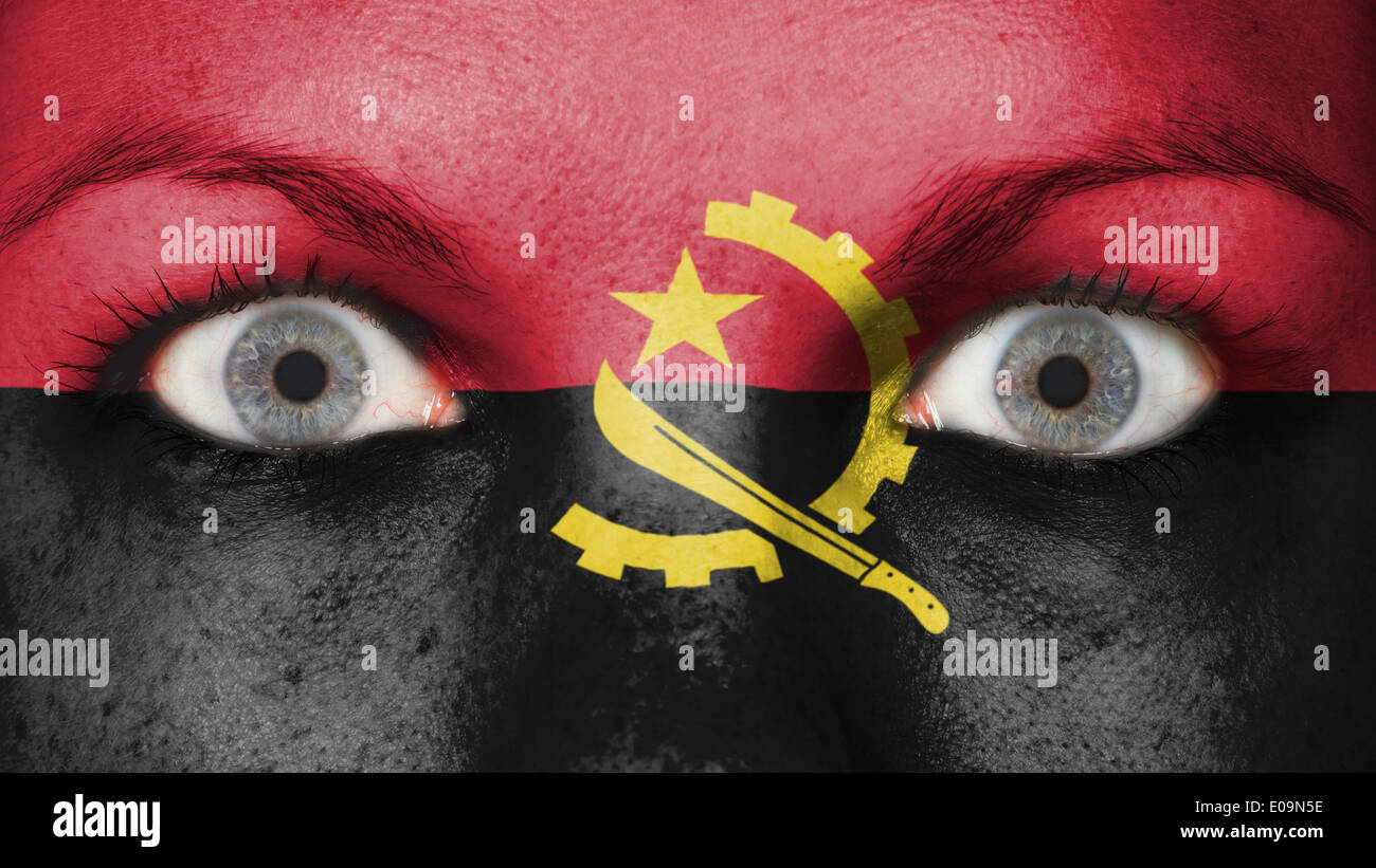 Close up of eyes. Painted face with flag of Angola Stock Photo - Alamy