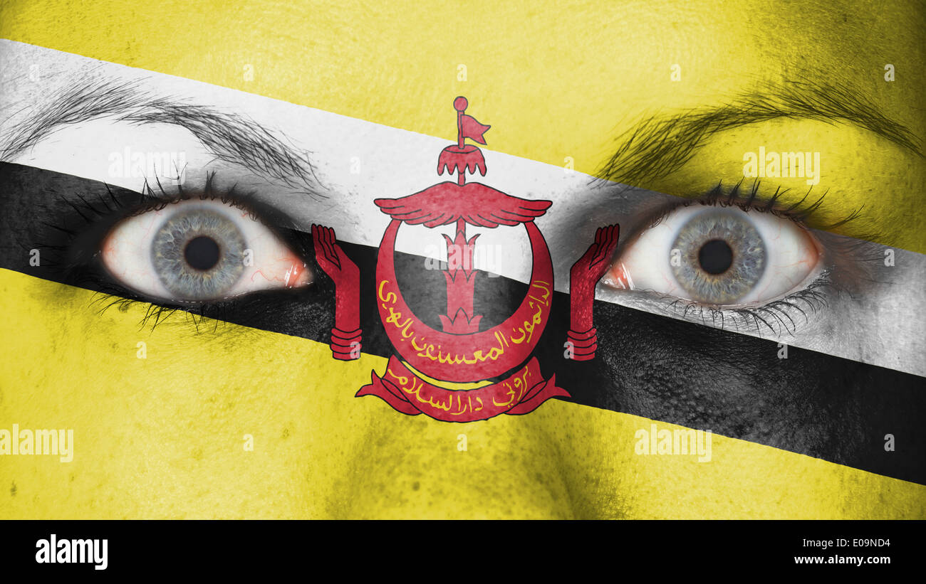 Close up of eyes. Painted face with flag of Brunei Stock Photo - Alamy