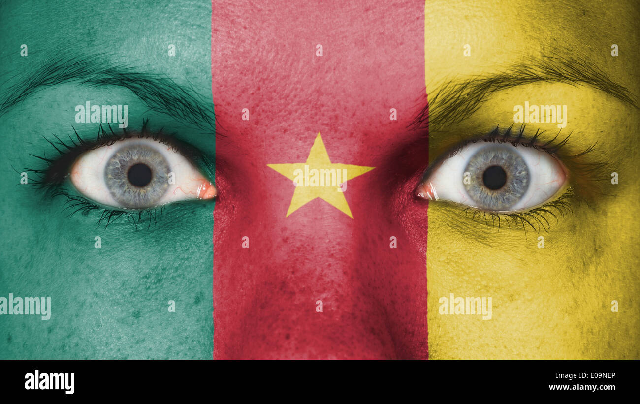 Close up of eyes. Painted face with flag of Cameroon Stock Photo - Alamy