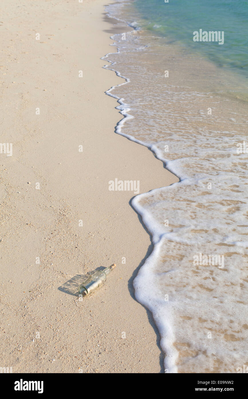 Message in a bottle on a beach Stock Photo - Alamy