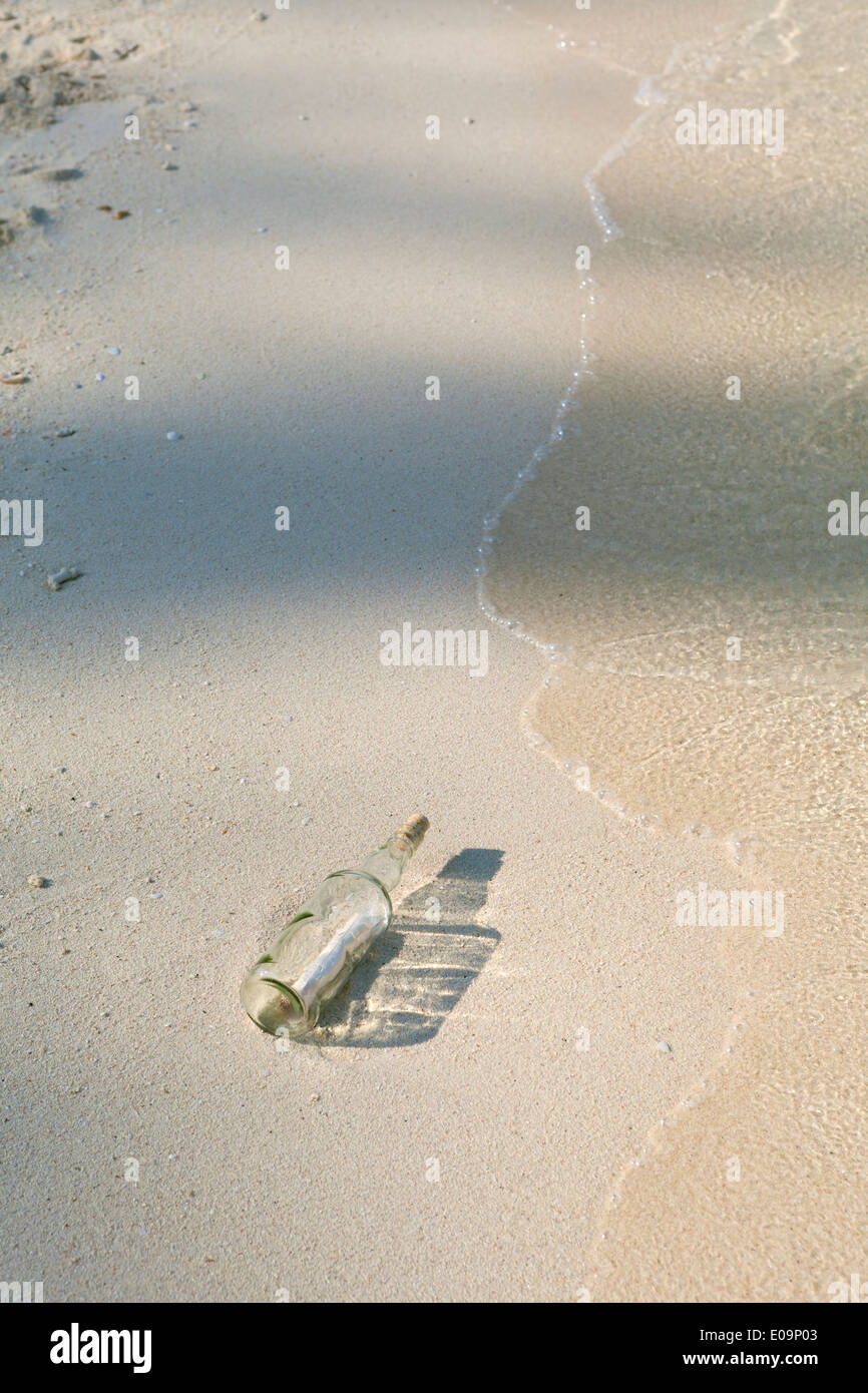 Message in a bottle on a beach Stock Photo - Alamy