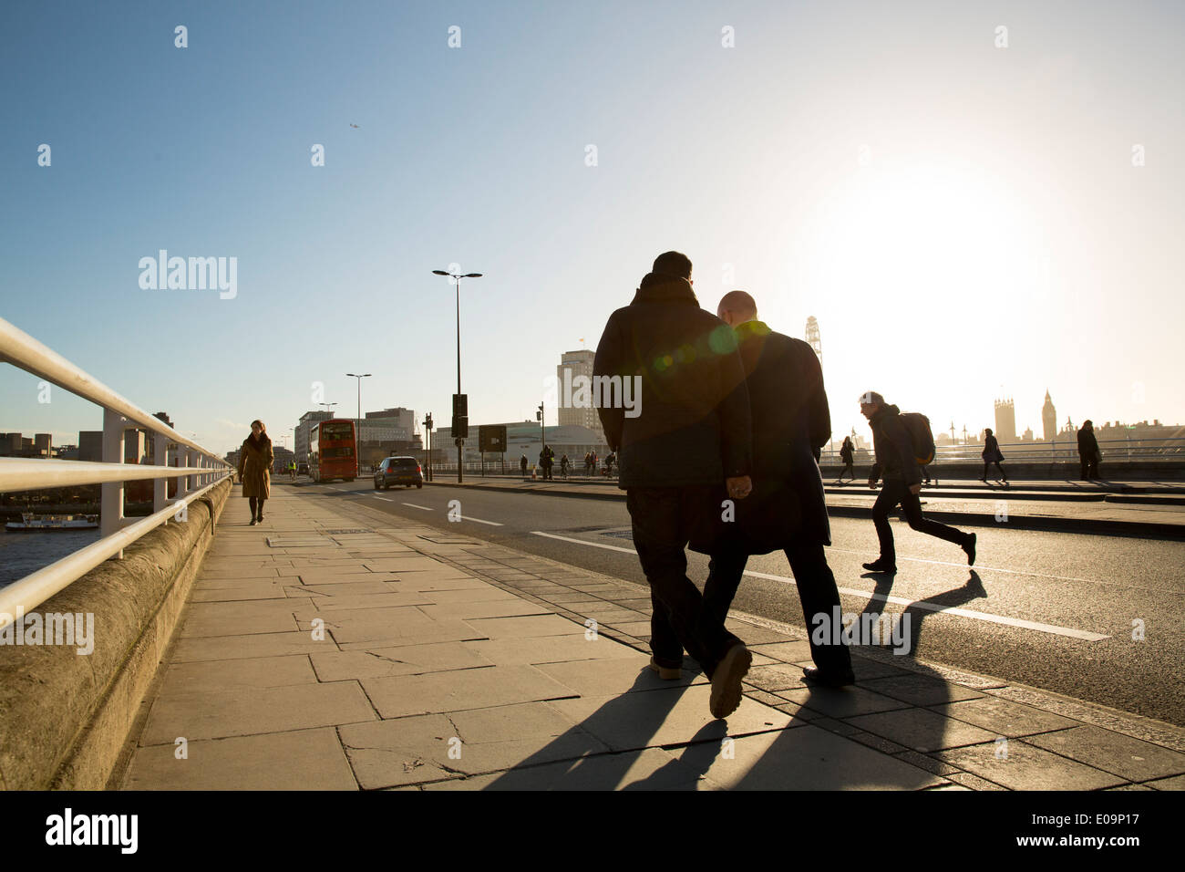 Commuters crossing Waterloo Bridge. The bridge crosses the Thames from ...