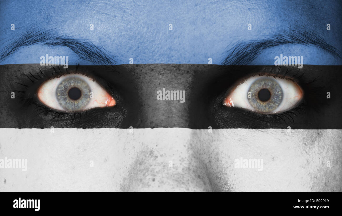 Close up of eyes. Painted face with flag of Estonia Stock Photo - Alamy
