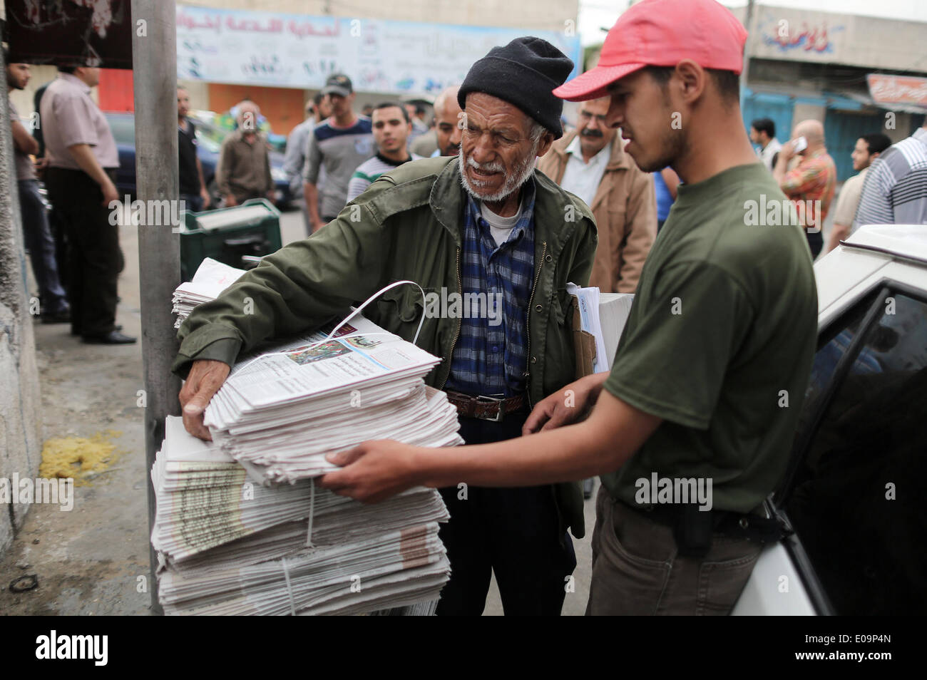 Gaza. 7th May, 2014. A Palestinian newspaper vendor shows a copy of the ...