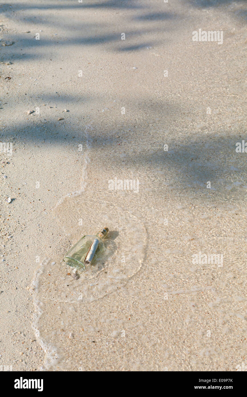 Message in a bottle on a beach Stock Photo - Alamy