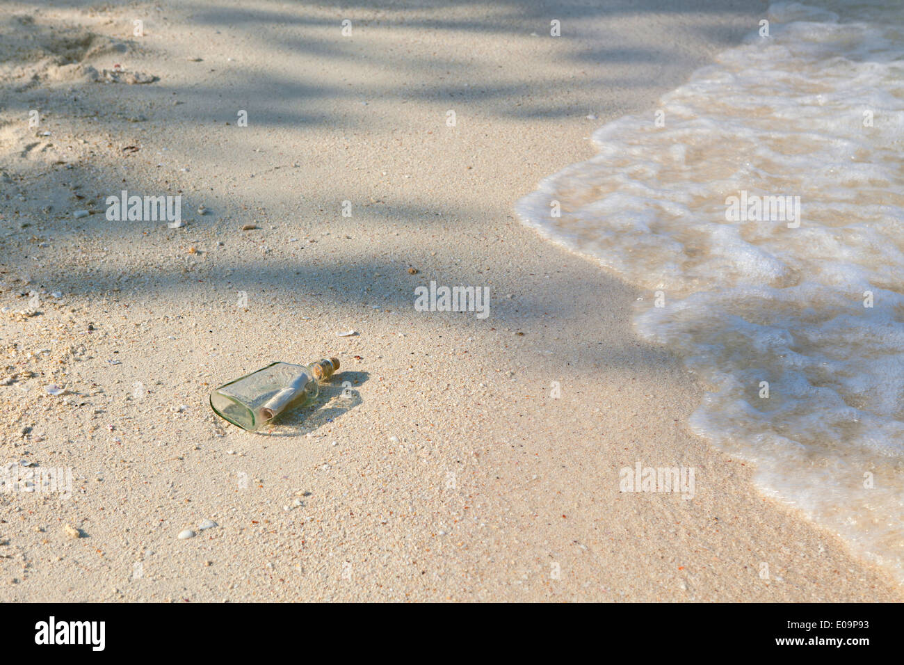 Message in a bottle on a beach Stock Photo - Alamy