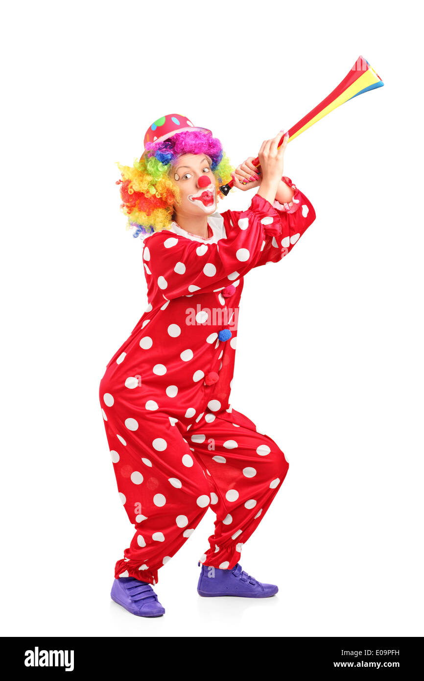 Female clown blowing a horn Stock Photo - Alamy