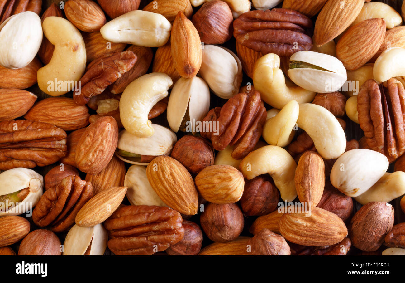 Background texture of assorted mixed nuts including cashew nuts, pecan ...