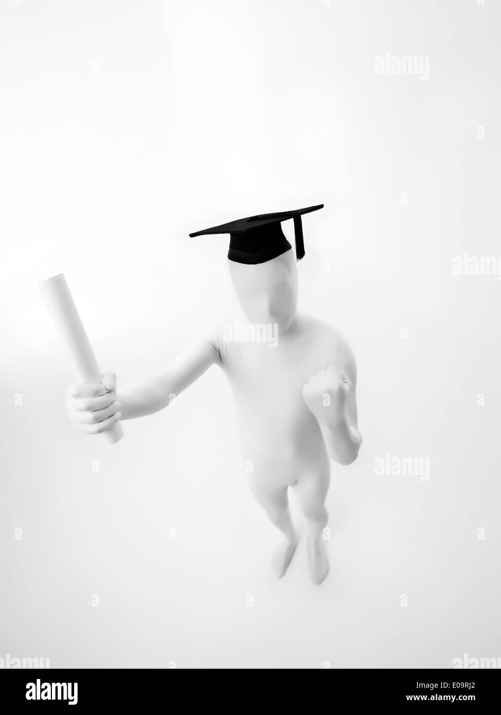 Unknown person dressed in black tie and white suit with graduate hat ...