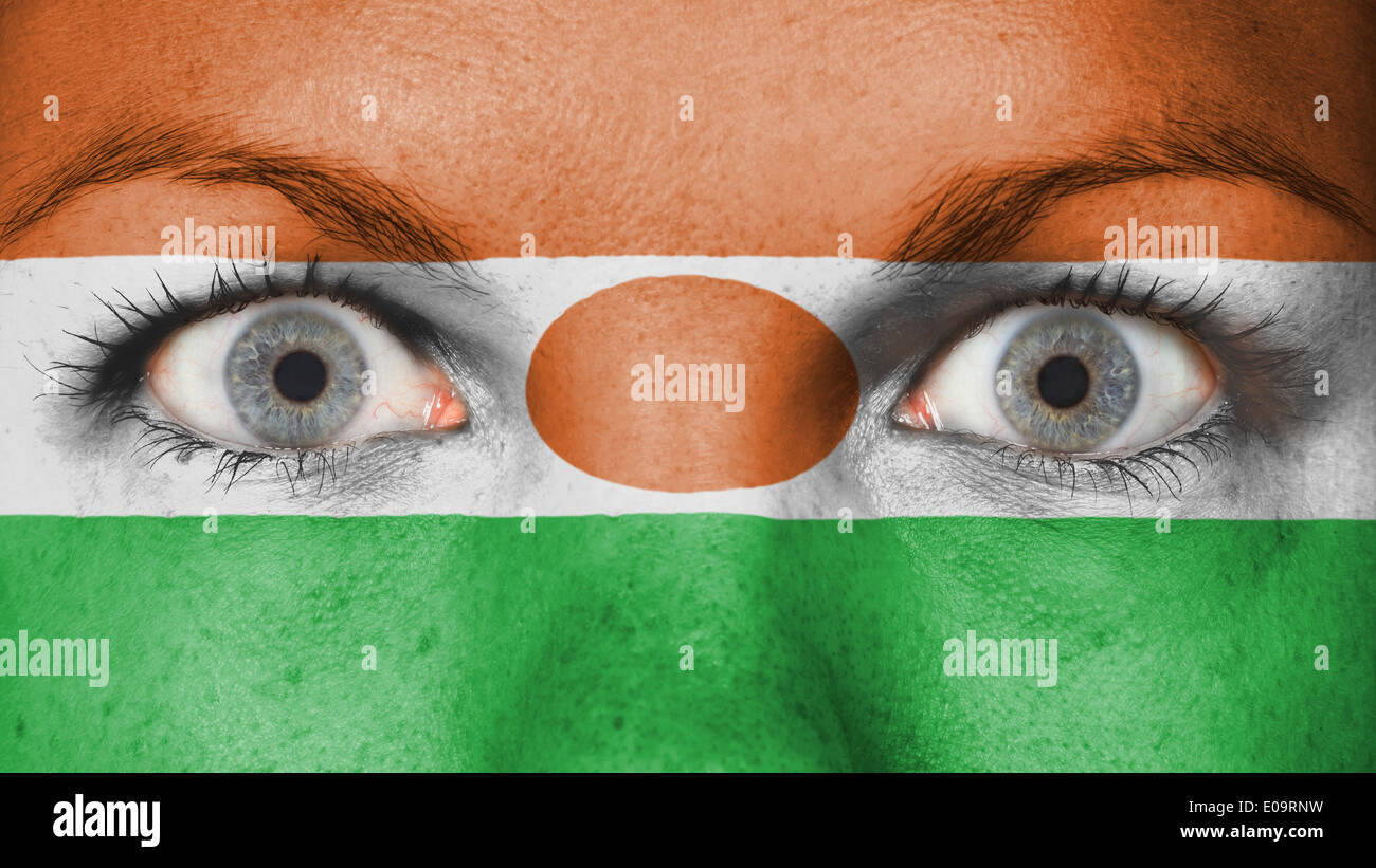 Close up of eyes. Painted face with flag of Niger Stock Photo - Alamy
