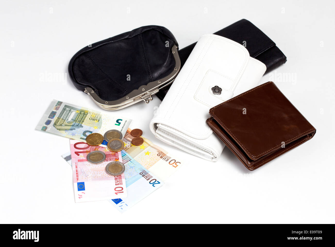 Different purses, banknotes and coins on white ground Stock Photo - Alamy