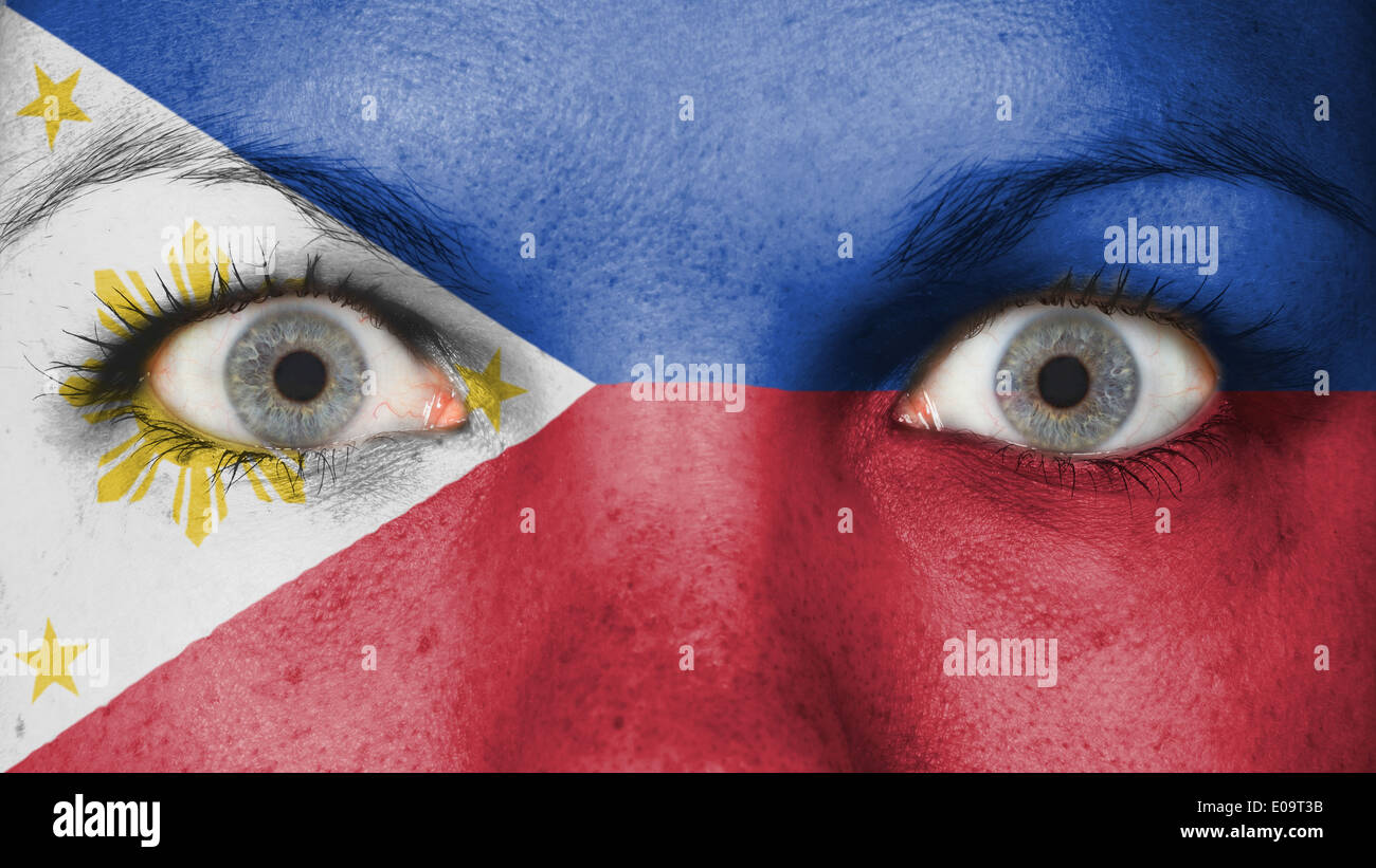Close up of eyes. Painted face with flag of Philippines Stock Photo - Alamy