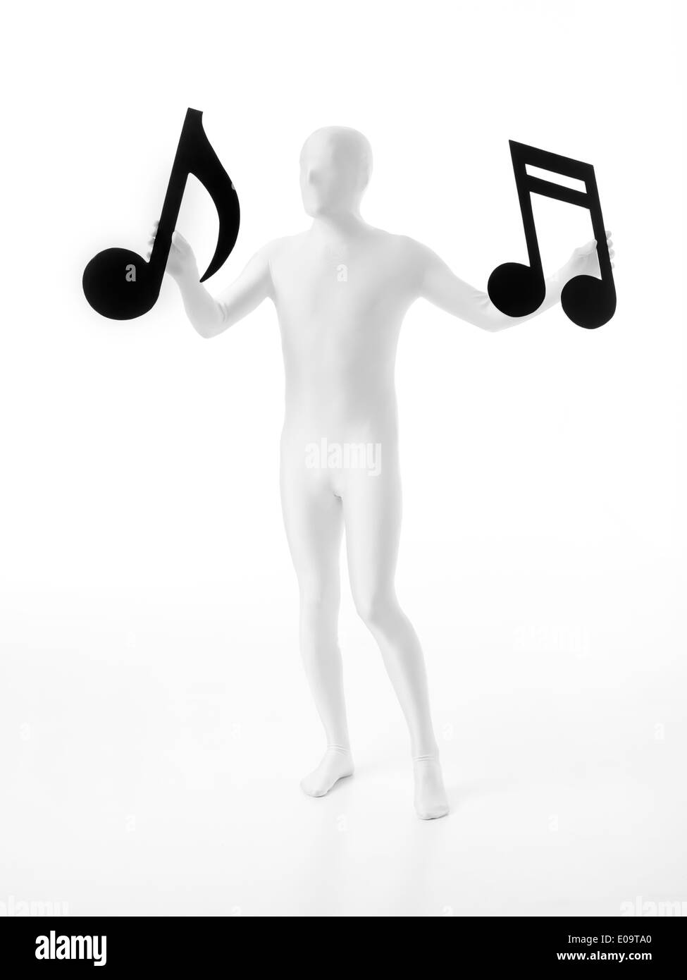 Unknown person dressed in a white suit holding musical notes Stock ...