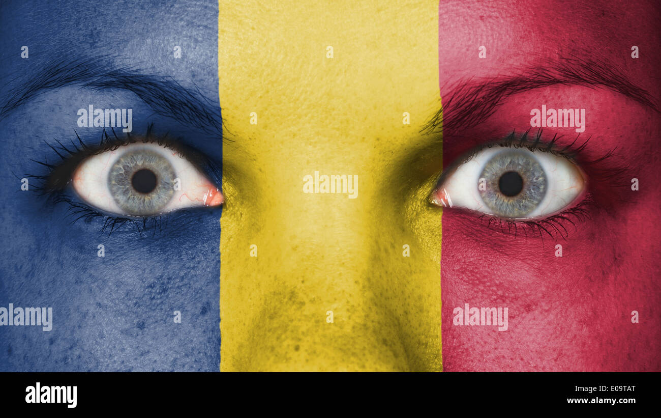 Close up of eyes. Painted face with flag of Romania Stock Photo - Alamy