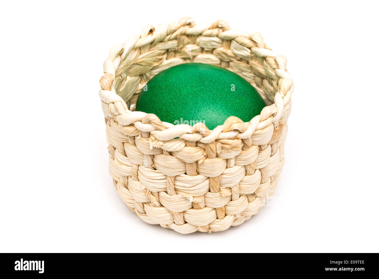 Green Easter Egg In Small Wood Basket Isolated Stock Photo - Alamy