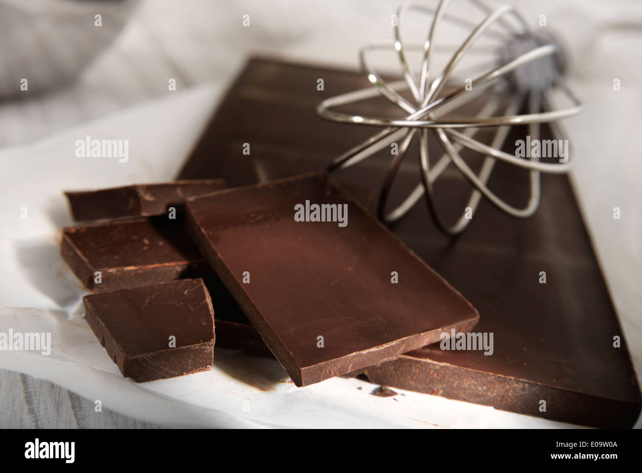 Bar of chocolate and egg beater Stock Photo - Alamy