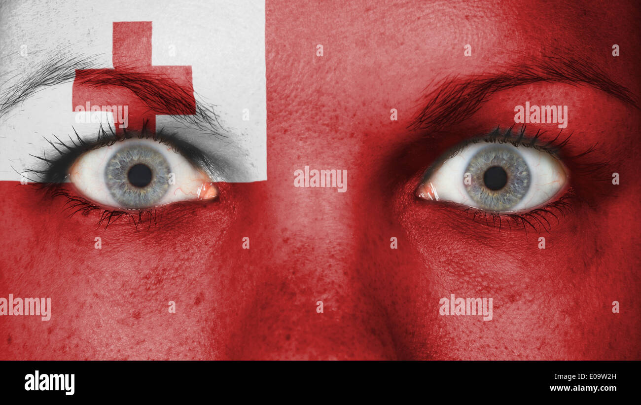 Close up of eyes. Painted face with flag of Tonga Stock Photo - Alamy