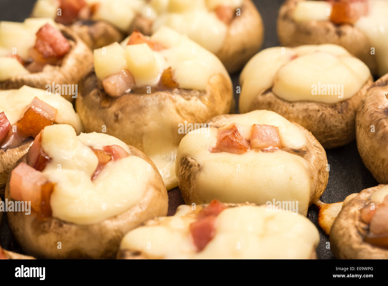 Fried Champignon Mushrooms With Baked Ham And Melted Cheese Stock Photo ...