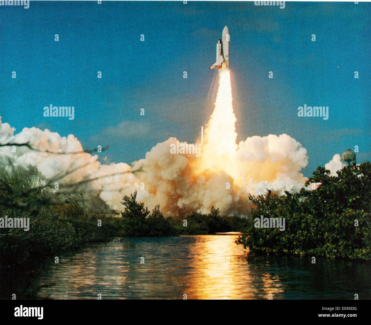 This glossy photo shows the Space Shuttle Program, capturing a pivotal moment in space ...