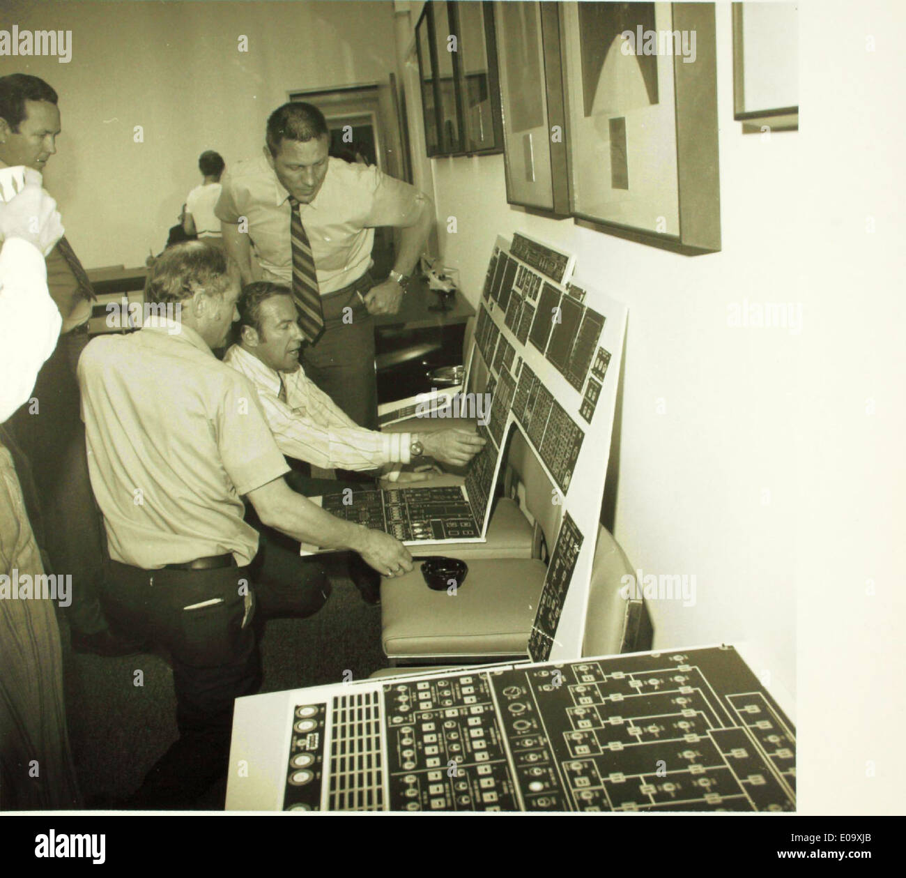 This glossy photo from the Space Shuttle Program features astronauts ...