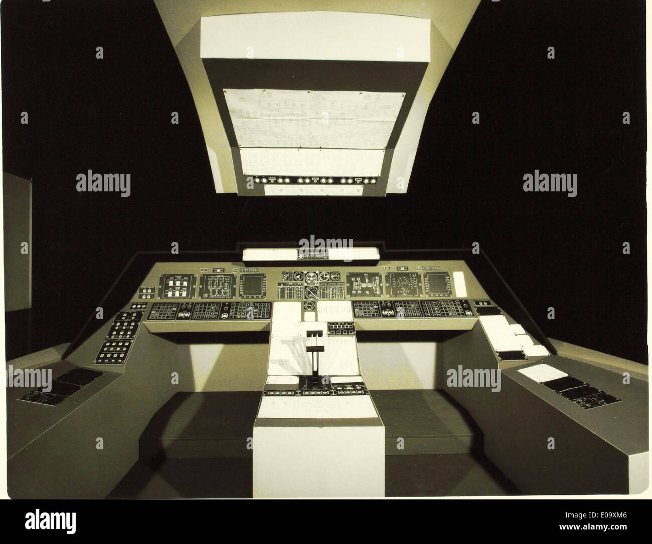 This glossy photo shows a mock-up of the cockpit of the NASA Space ...
