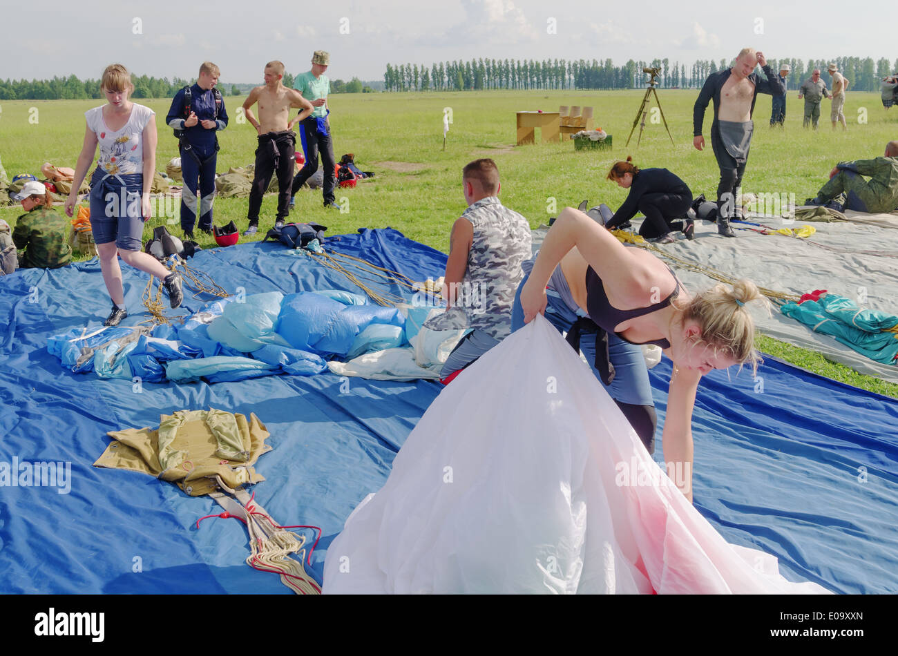 One day with parachutist in airfield. Packaging of parachutes Stock ...