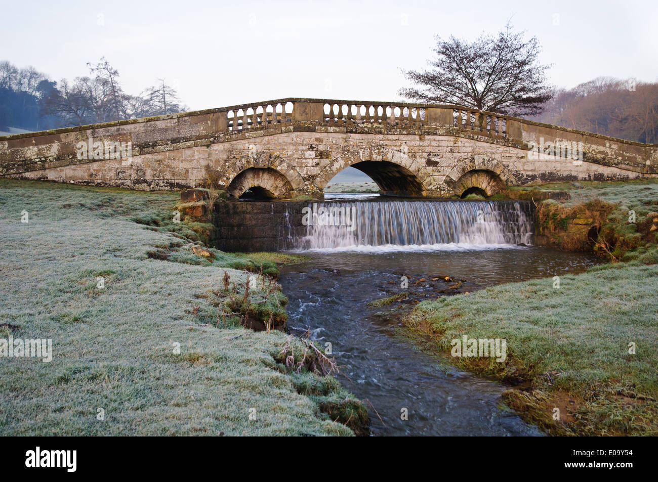 A view of the arched bridge over the beck that runs through Hovingham ...
