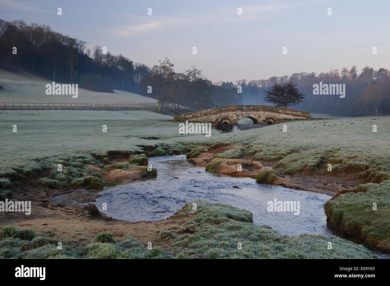 A view of the arched bridge over the beck that runs through Hovingham ...