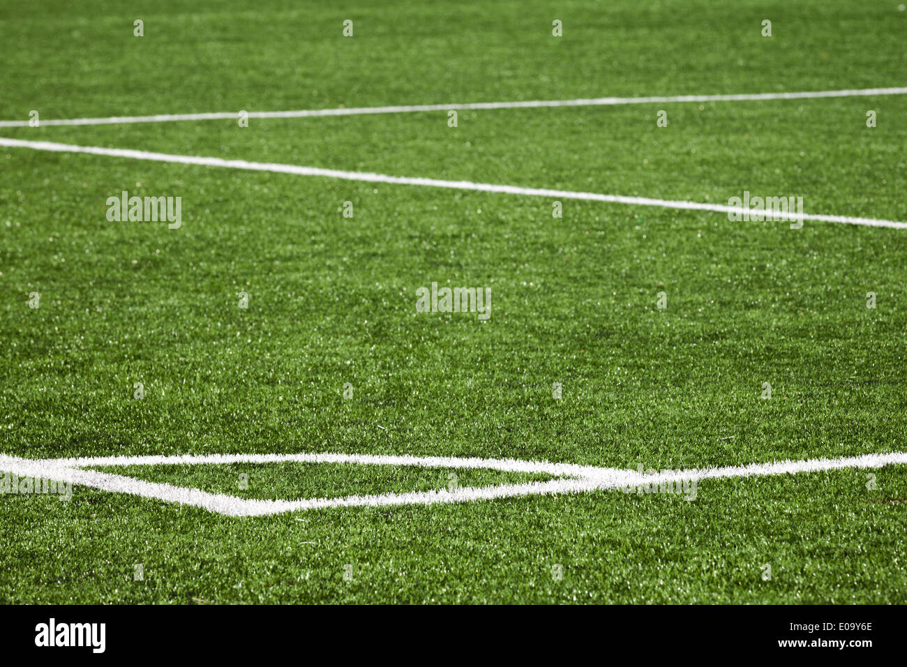 Football playing field background with white marking on green grass ...