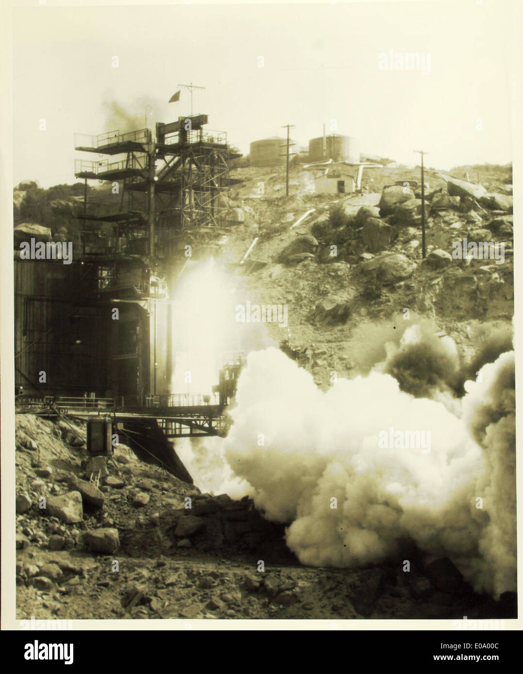 This glossy photo captures a Rocketdyne rocket motor test conducted by ...